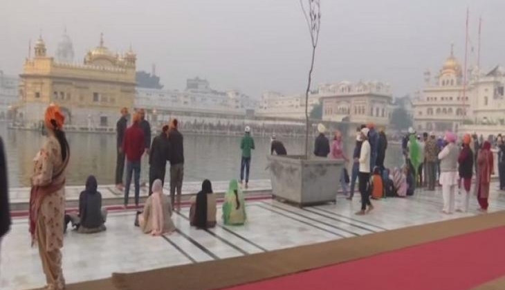 Devotees throng Golden Temple on 550th birth anniversary of Guru Nanak ...