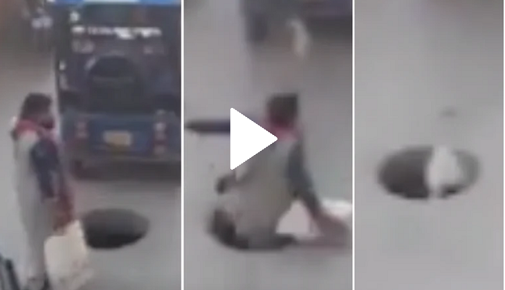 Woman falls into manhole while talking on phone; watch shocking video ...