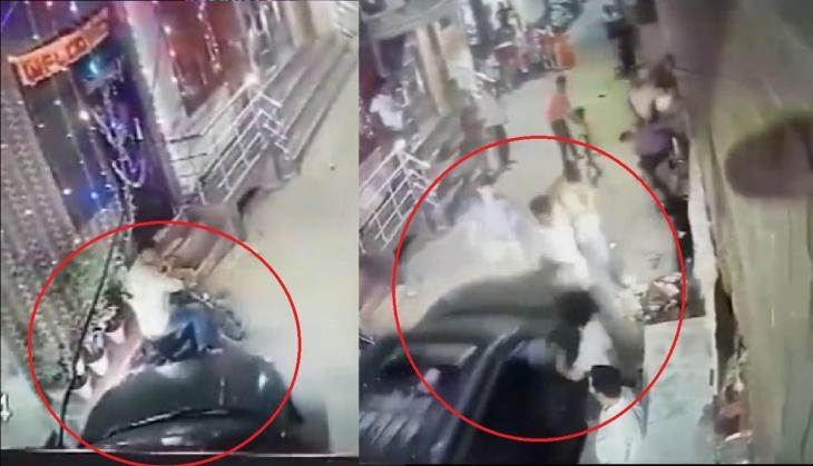 Delhi car runs over people after fight with biker [Video] | Catch News